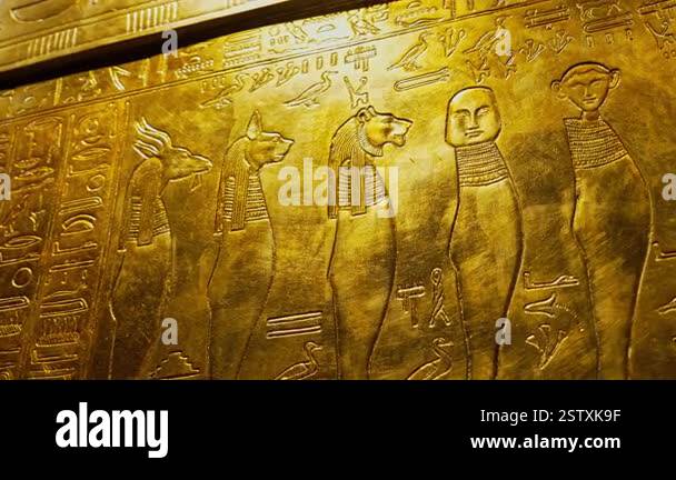 Isis wall carving on golden wall of tomb Macro view of goddess spread ...