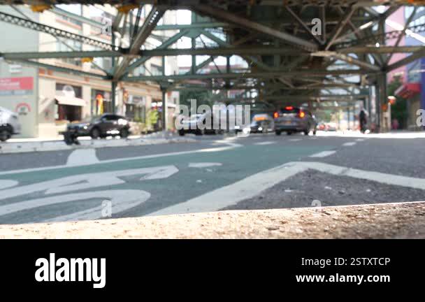 Elevated subway above New York City street. Metropolitan bridge over ...