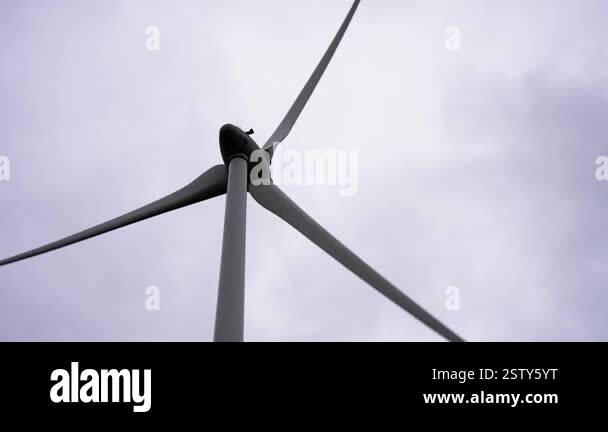 Wind turbines spinning. Detail of huge and large turbines rotating ...