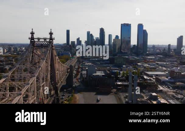 Aerial views capture the Queensboro Bridge, gradually revealing the ...