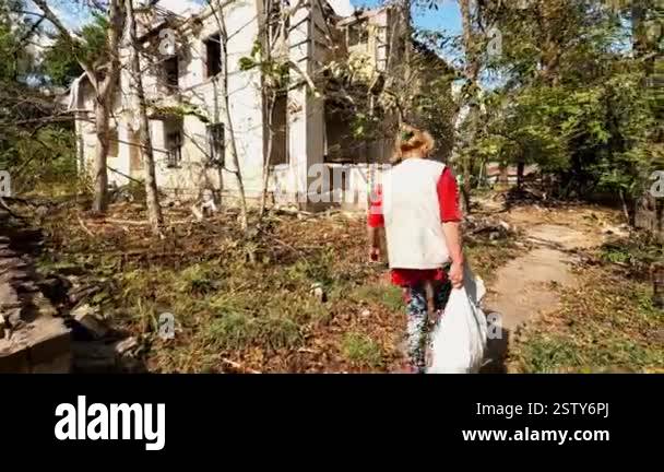 View to destroyed residential building at Donbass. Ruined house after ...