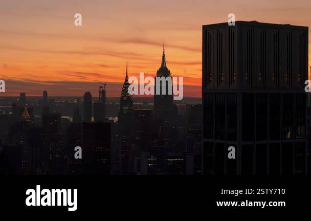Aerial views showcase New York City skyline at sunset, highlighting ...