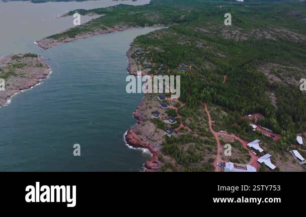 Aerial view moving forward over the coastline of the Aland islands in ...