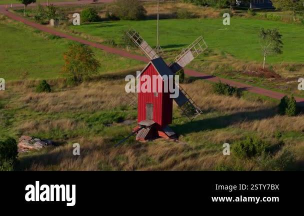 Aerial view of a traditional red wooden windmill in the countryside of ...