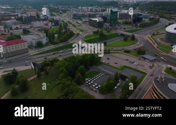 Aerial views capture cars flowing along a busy highway in Vilnius ...
