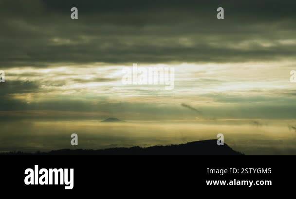 Timelapse of the view of the dramatic and beautiful overcast sky lit ...