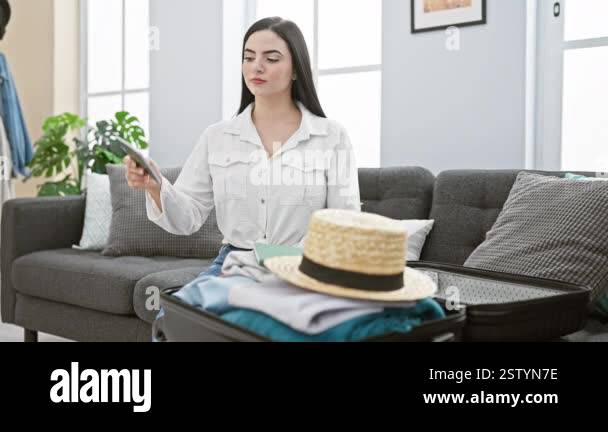 Excited, confident young hispanic woman with radiant smile beams ...