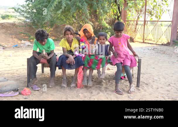 PUSHKAR, INDIA - NOVEMBER 17, 2018 : Indian poor children in the desert ...