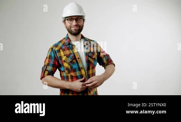 Confident bearded engineer in colorful shirt and glasses with crossed ...