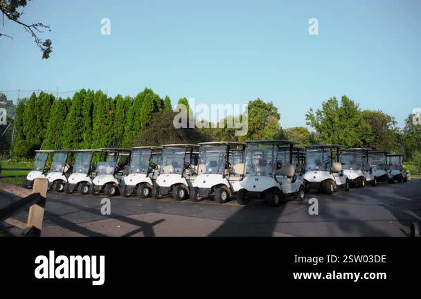 Wide view of Golf carts parked in a designated area at a golf club ...