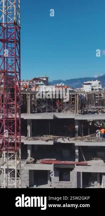 Wall construction and metalwork ongoing. Aerial footage of a dynamic ...