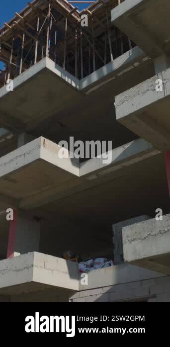 Metal beams, walls, and concrete ongoing. Aerial footage of a dynamic ...