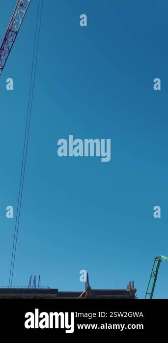 Concrete pouring and wall building. Aerial footage of skilled workers ...