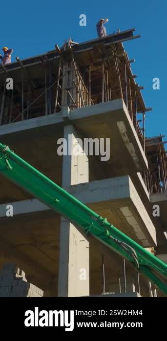 Beam installation and crane lifting. Aerial footage of a vibrant and ...