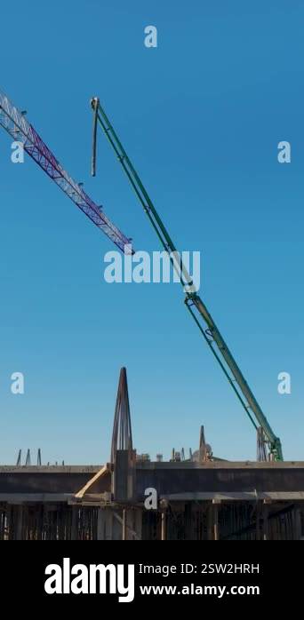 Concrete pouring and crane operations. Aerial footage of a productive ...