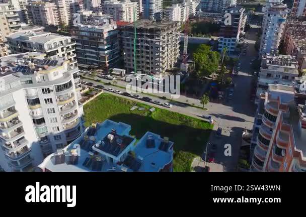 Tall building under construction. Aerial footage of a city expansion ...