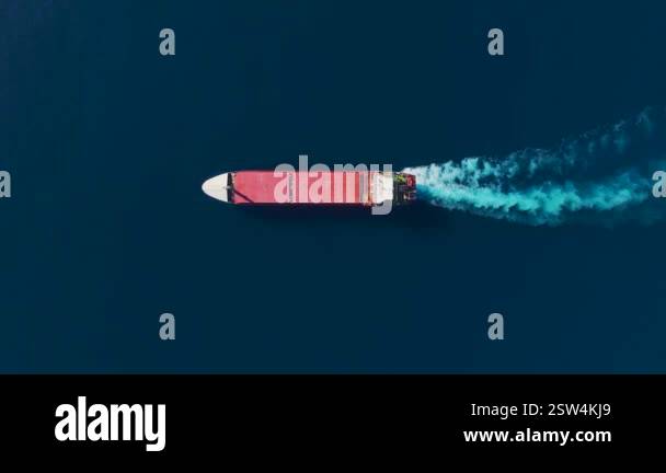 See the huge cargo ship drop anchor in the deep blue sea beneath a ...