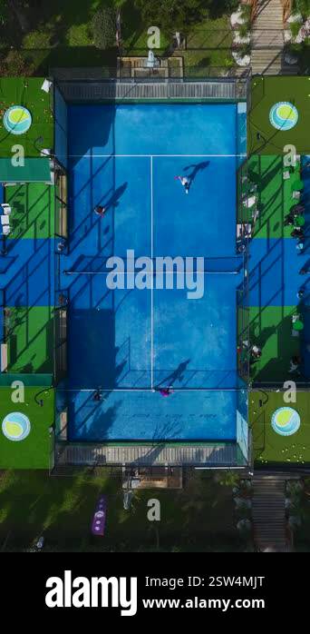 Coastal padel court aerial. Vertical footage of a scenic sports ...