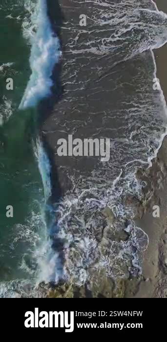 Coastal sand texture. Vertical footage of a unique and abstract beach ...