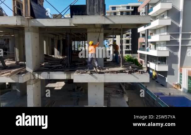 Watch workers demonstrate their construction expertise as they advance the project on a busy ...