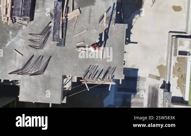 A bustling construction site with workers using their experience to make steady progress Stock ...