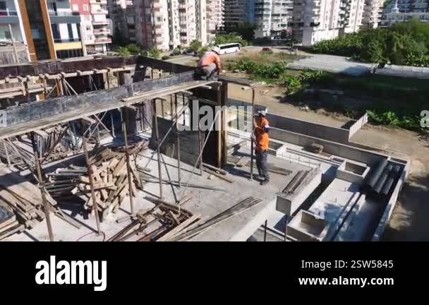 A site buzzing with workers making steady progress, showing expertise ...