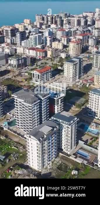 Aerial workers on scaffolding. Vertical footage of high-altitude ...