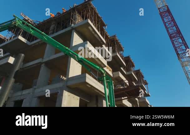 Precision concrete work on high-rise levels Stock Video Footage - Alamy