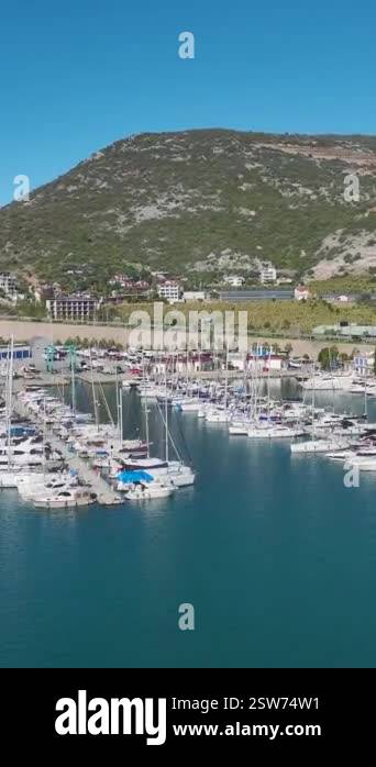 Yacht harbor and turquoise sea. Aerial view of a luxurious and peaceful ...