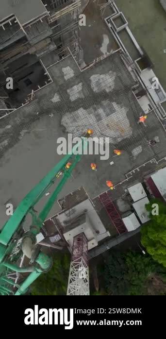 Building a solid foundation with concrete pouring in progress Stock ...