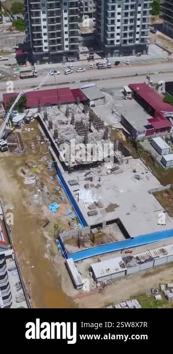 A housing district grows with step-by-step construction efforts Stock ...