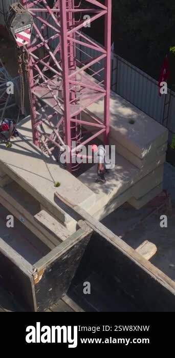 Dynamic Crane Assembly With Engineers Working Precisely Stock Video ...