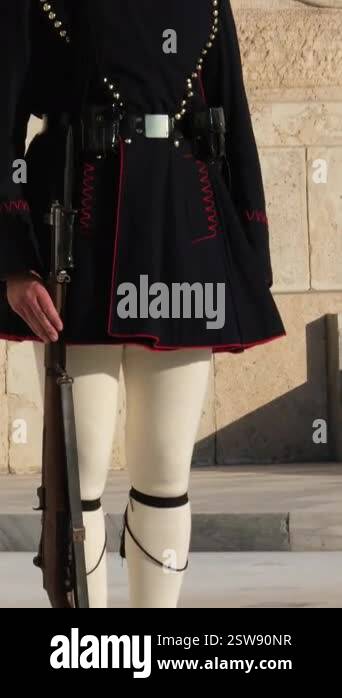 Greek Presidential Guard evzone in national clothes uniform at the tomb ...