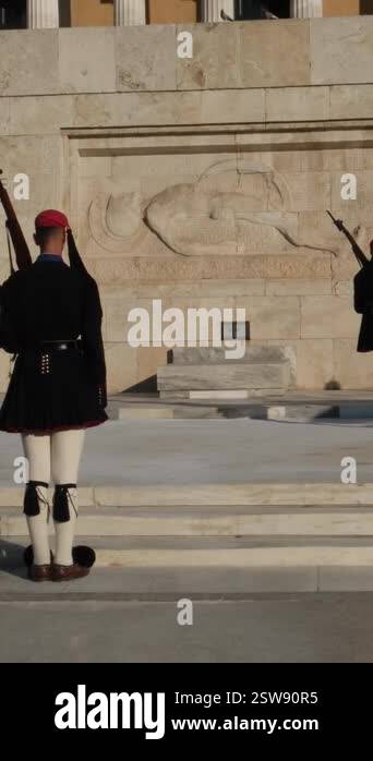 Greek Presidential Guard evzone in national clothes uniform at the tomb ...