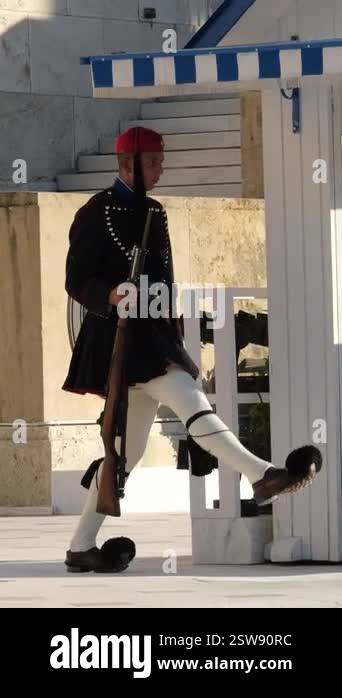 Greek Presidential Guard evzone in national clothes uniform at the tomb ...