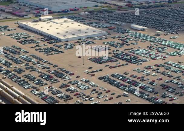 New cars parked for sale on automotive factory parking lot. Dealer ...