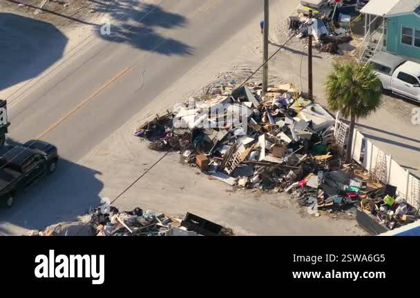 Trash from severely damaged houses after hurricane Milton storm surge ...
