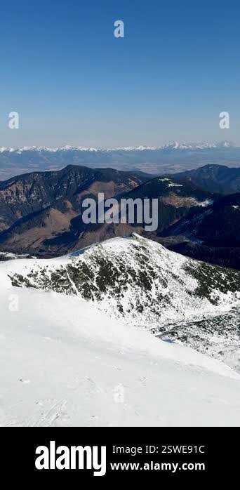 Ski resort, horizon view of snow-capped mountains and backcountry on a ...