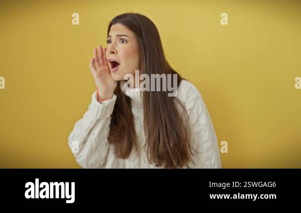 Fiery hispanic woman in sweater, screaming out a loud yell over ...