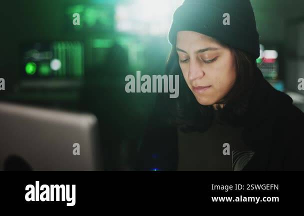 Female hacker breaking into a secure network, programming malicious ...
