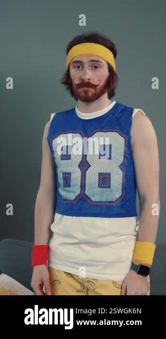 A male model proudly showcases vibrant, retroinspired athletic wear in ...