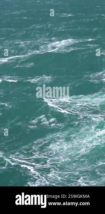 Choppy waves by the side of a cruise ship on stormy ocean with white ...