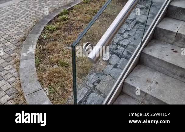 the glass railing fillings are attached to the stainless steel tubular ...