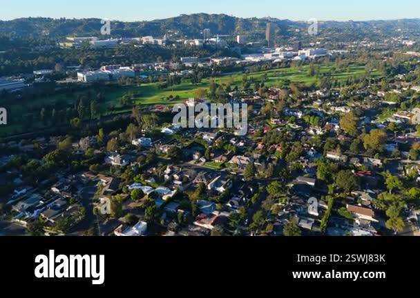 A breathtaking 4k aerial view of Toluca Lake and the Burbank skyline in ...