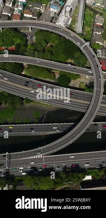 Elevated highway crossing over residential areas with visible greenery ...