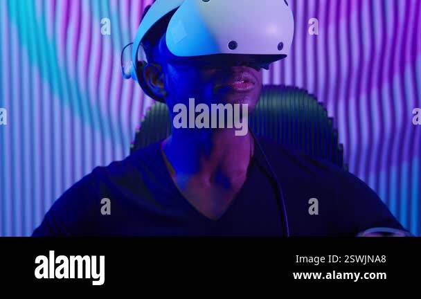 Cyber gamer African American man in VR glasses play virtual reality ...