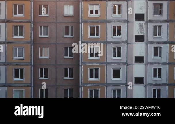 Urban brutal post-Soviet panel house with window. 90s residential area ...