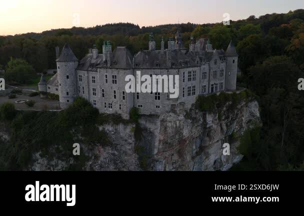 Nestled near Dinant, Walzin Castle stands majestically atop rocky ...