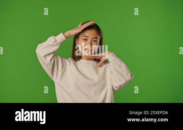 Children emotions concept. Asian girl child posing at camera like a ...