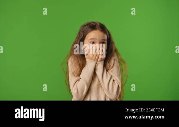 Children emotions concept. Girl child with shocked face looks at camera ...